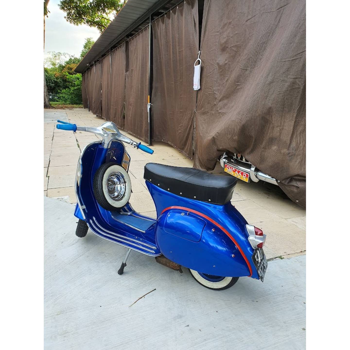 Chrome Blue Vespa - Classic Vintage Bikes as Merchandising Props for Rent
